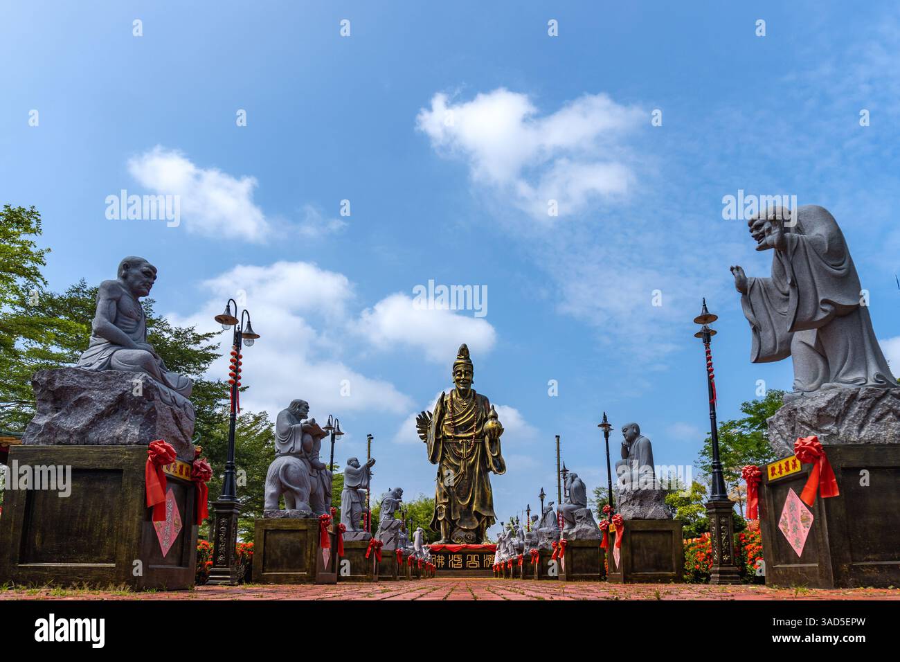 Yong Peng, Johor, Malaysia: Wide View of the Majestic Ji Gong Statue Surrounded by Guardian ...