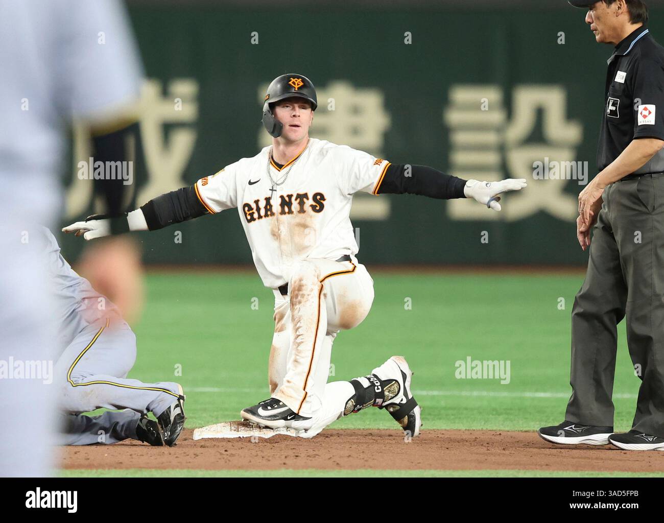 Yomiuri Giants' Trey Cabbage reacts after a double at second base in ...