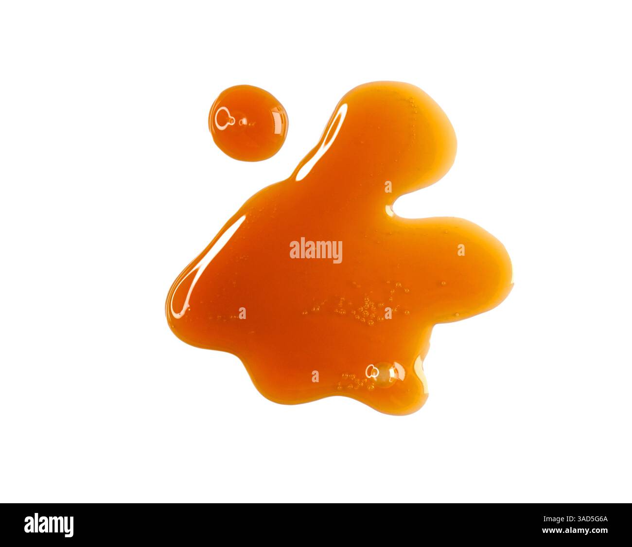 Abstract smear, puddle of sweet caramel isolated on white, top view ...