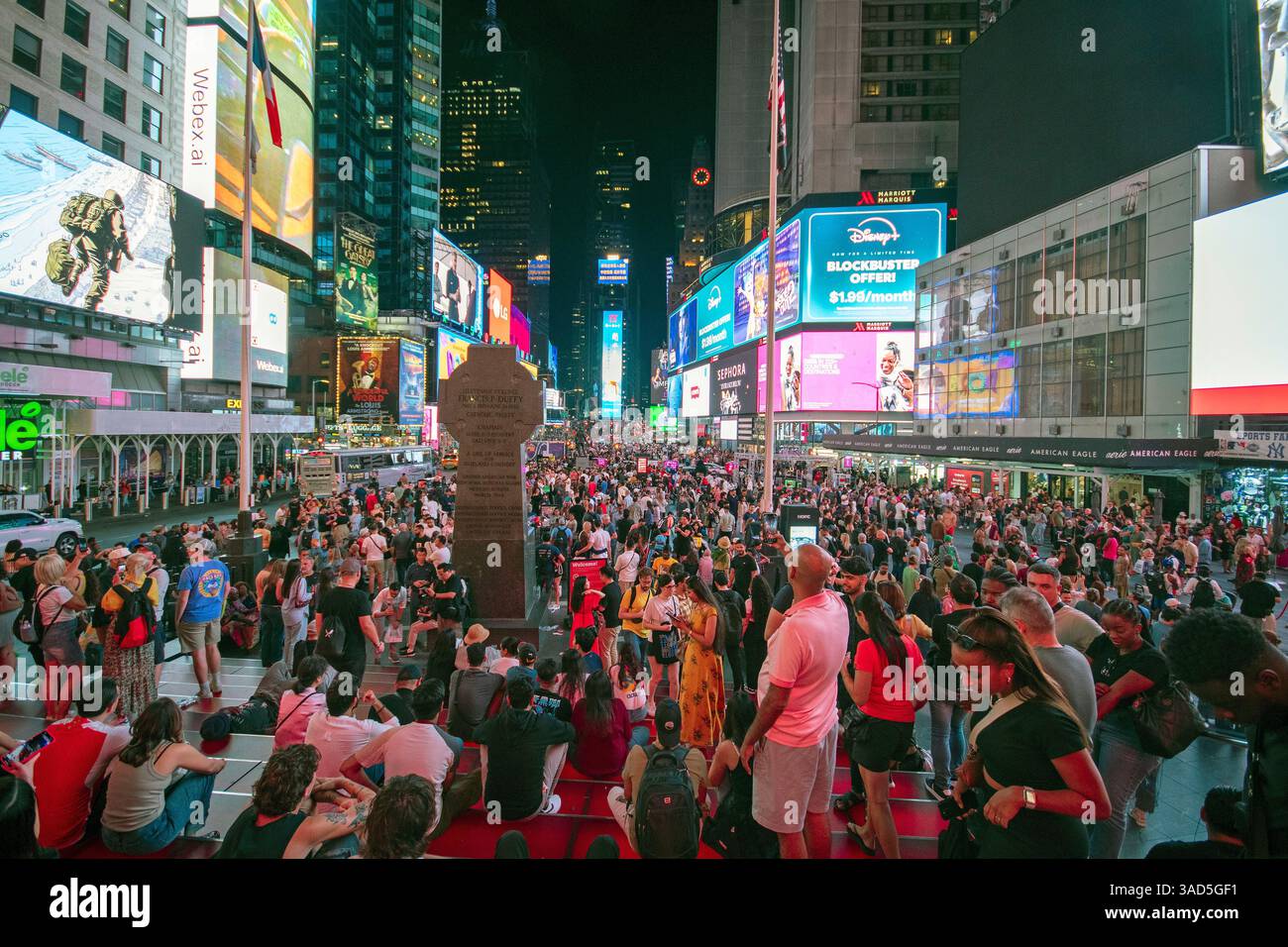 Crowd of people in Times Square by night, Manhattan, New York City, USA ...