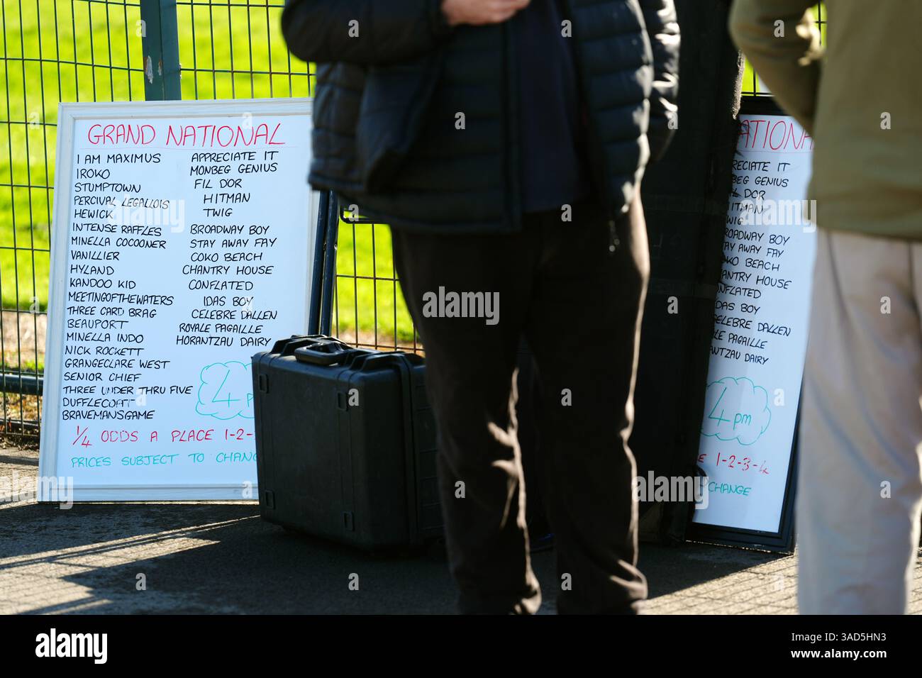 A board listing the runners of the Grand National on day three of the ...