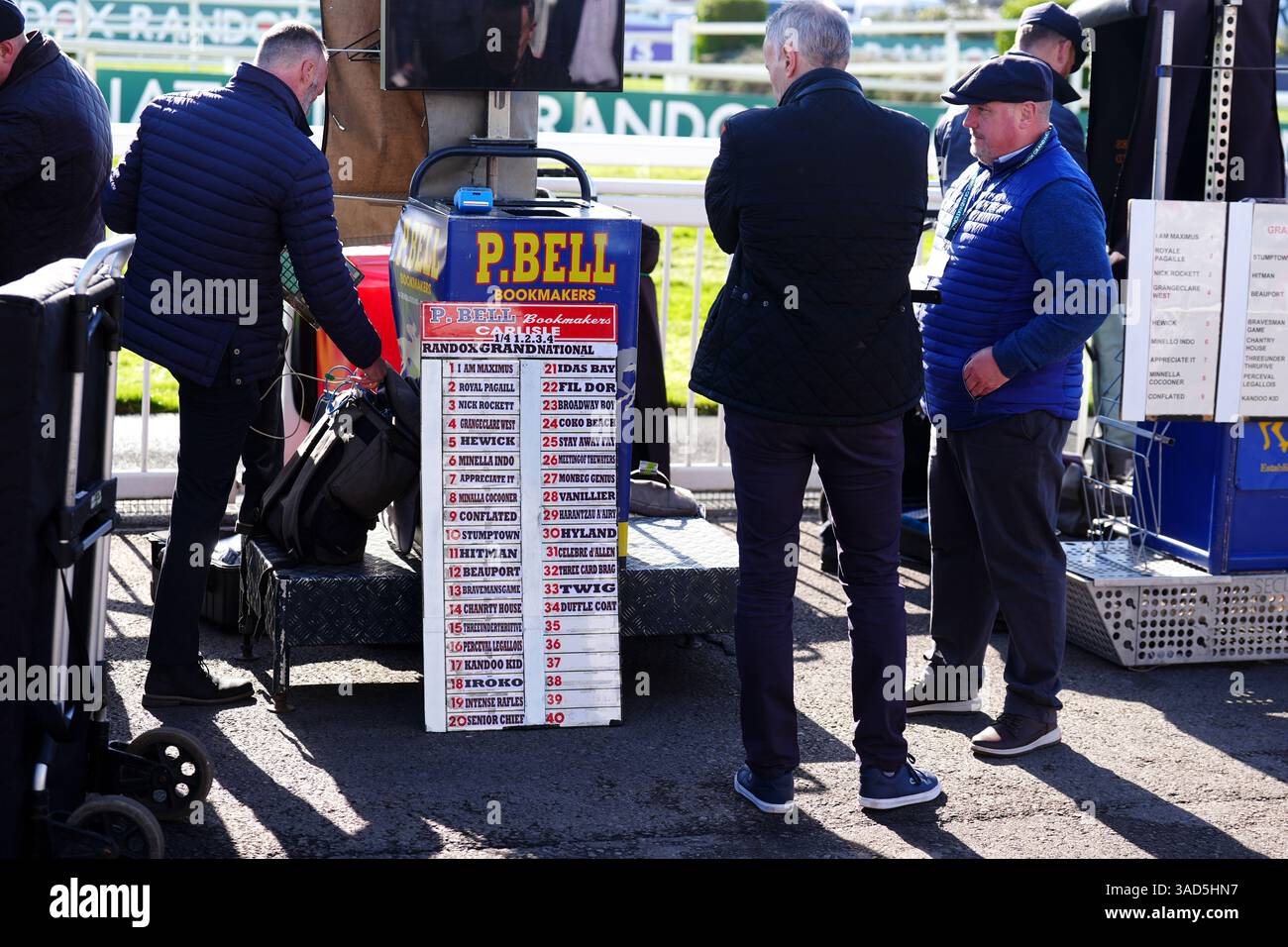 A board listing the runners of the Grand National on day three of the ...