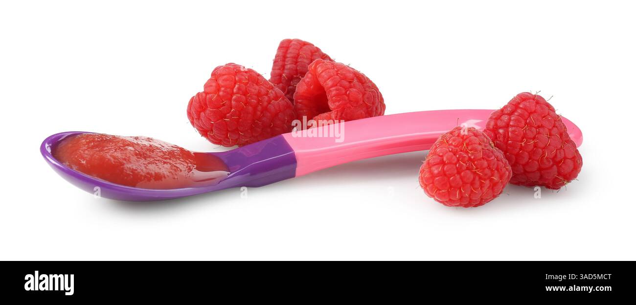 Baby food. Tasty puree in spoon and raspberries isolated on white Stock ...