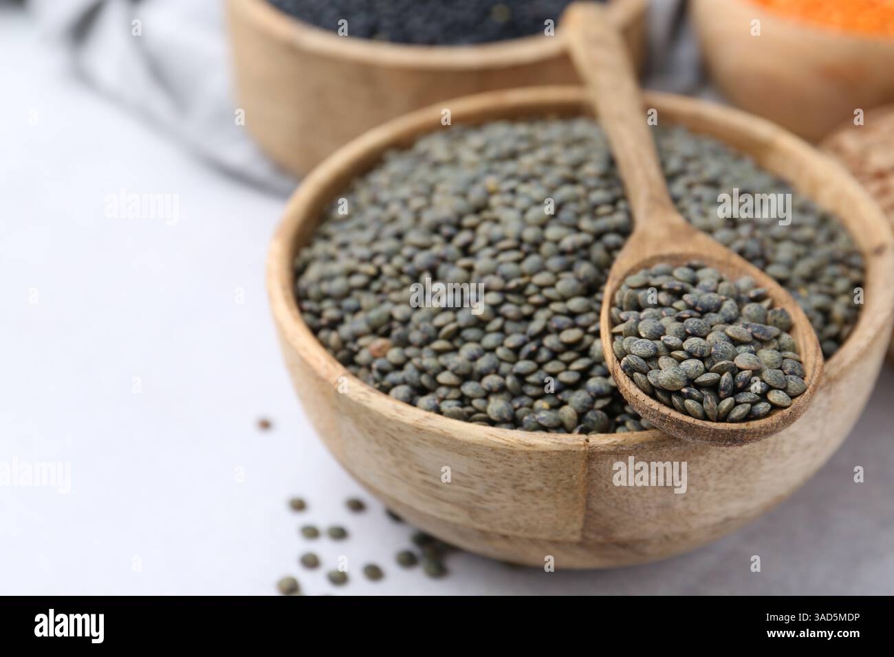 Different types of lentils on light table, closeup Stock Photo - Alamy