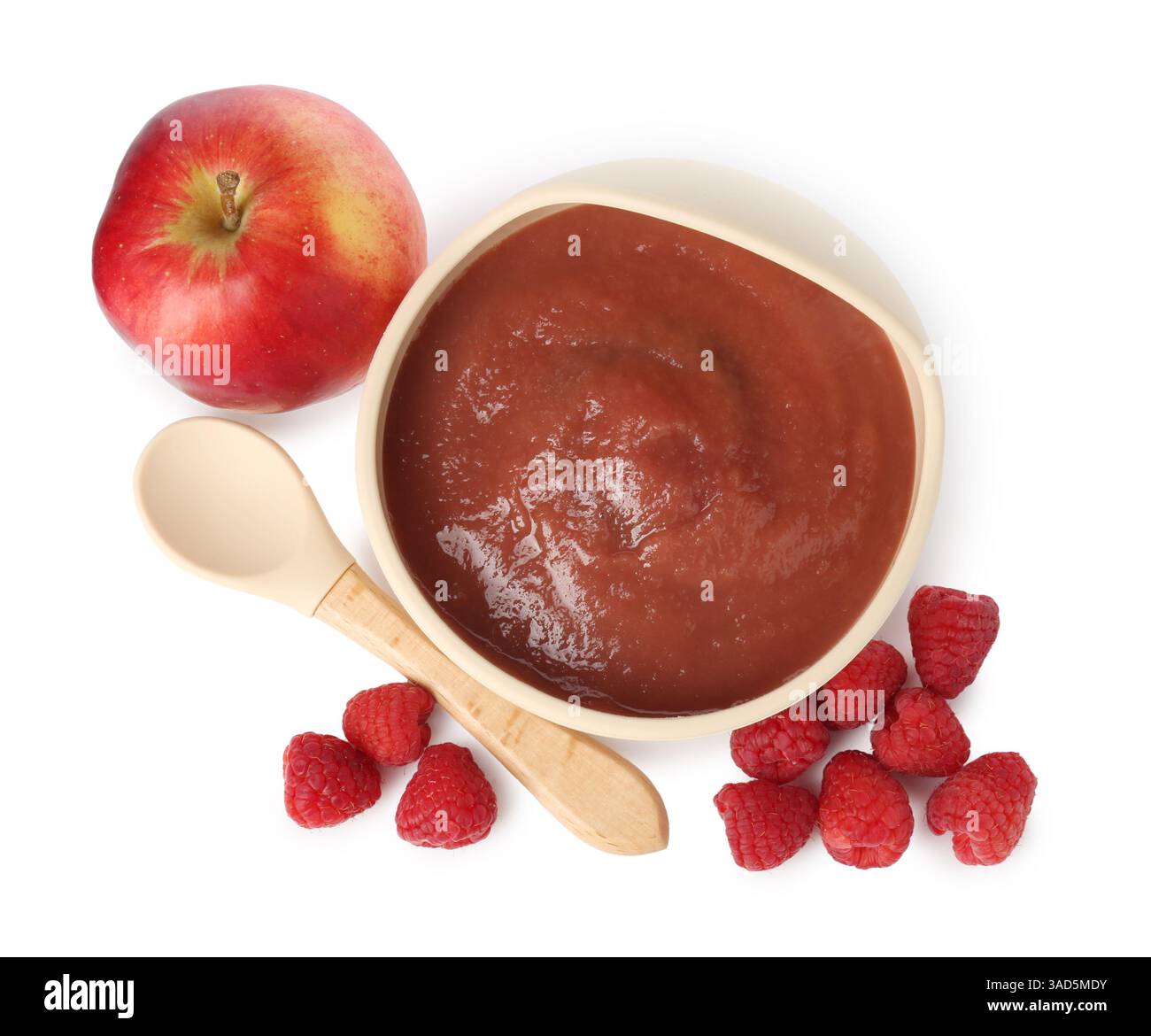 Baby food. Tasty puree in bowl, spoon, apple and raspberries isolated ...