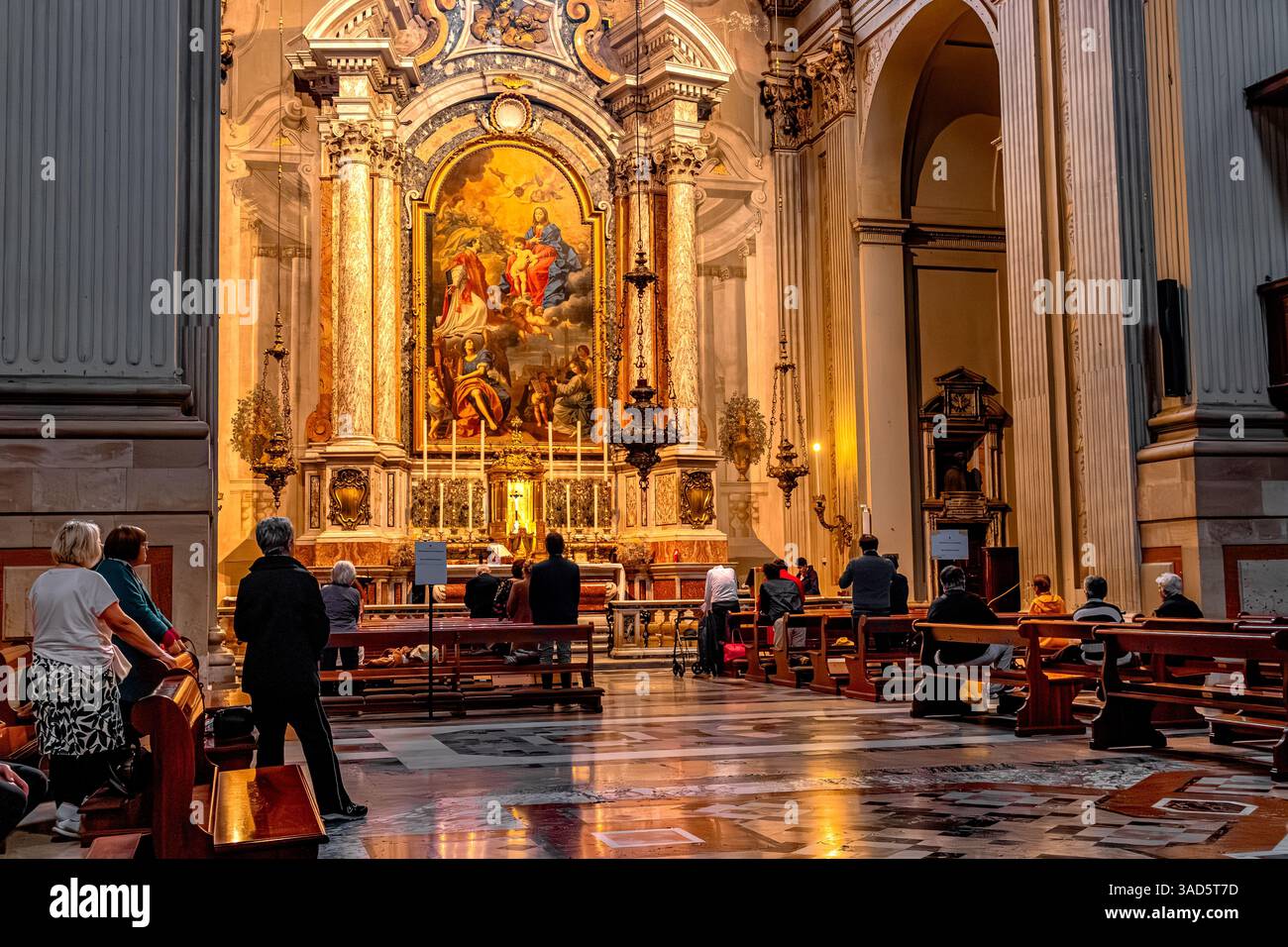 People attending a mass in a side chapel of The Metropolitan Cathedral ...