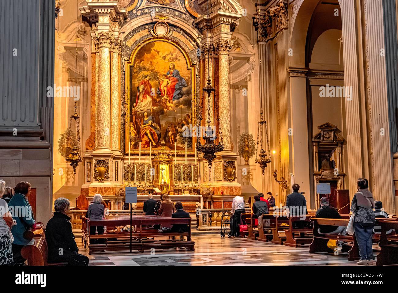 People attending a mass in a side chapel at The Metropolitan Cathedral ...