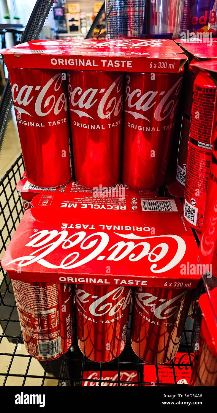 Multipack cans of Coca-Cola Original Taste in shopping cart in ...
