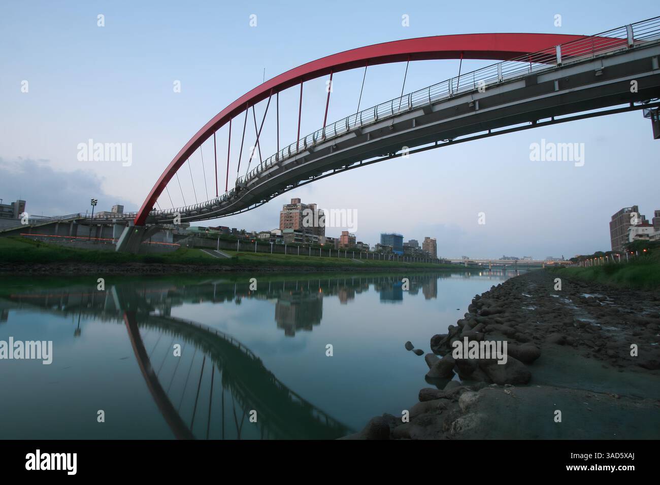 A view of Taipei's Rainbow Bridge at twilight, a pedestrian-only bridge ...