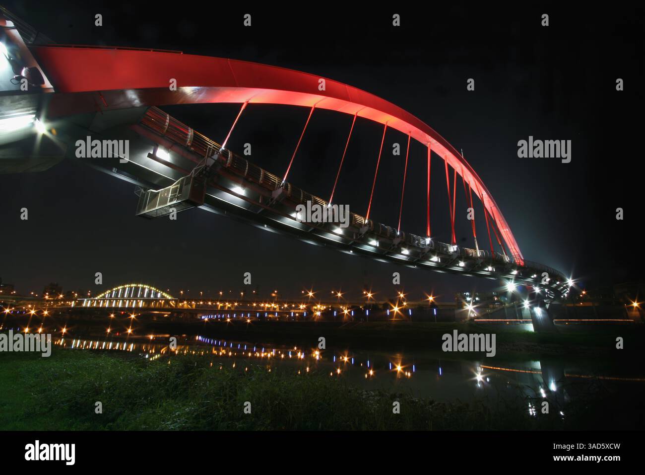 The Rainbow Bridge becomes a radiant passage through the night ...