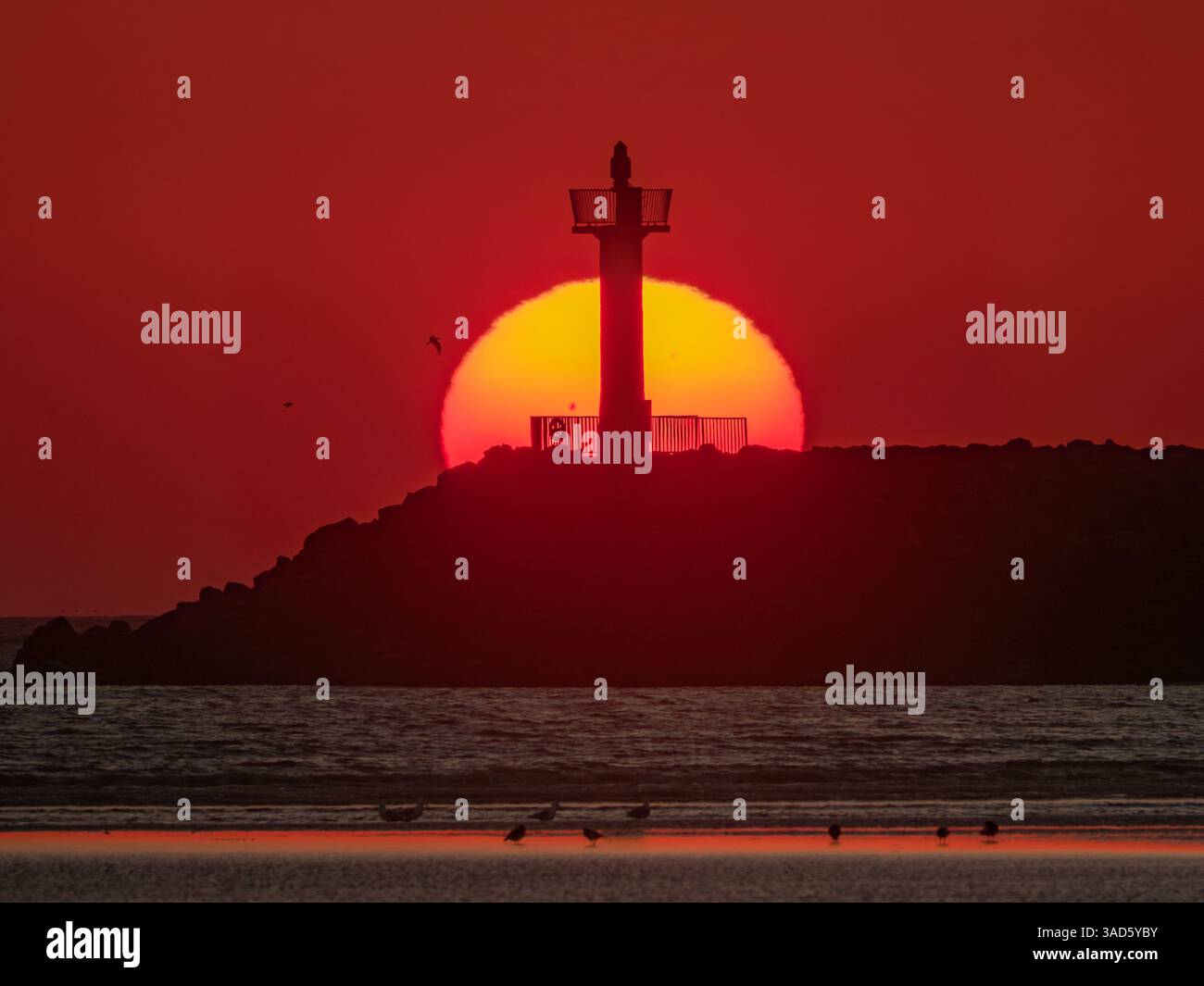Sunrise aligned with Howth Lighthouse Stock Photo - Alamy
