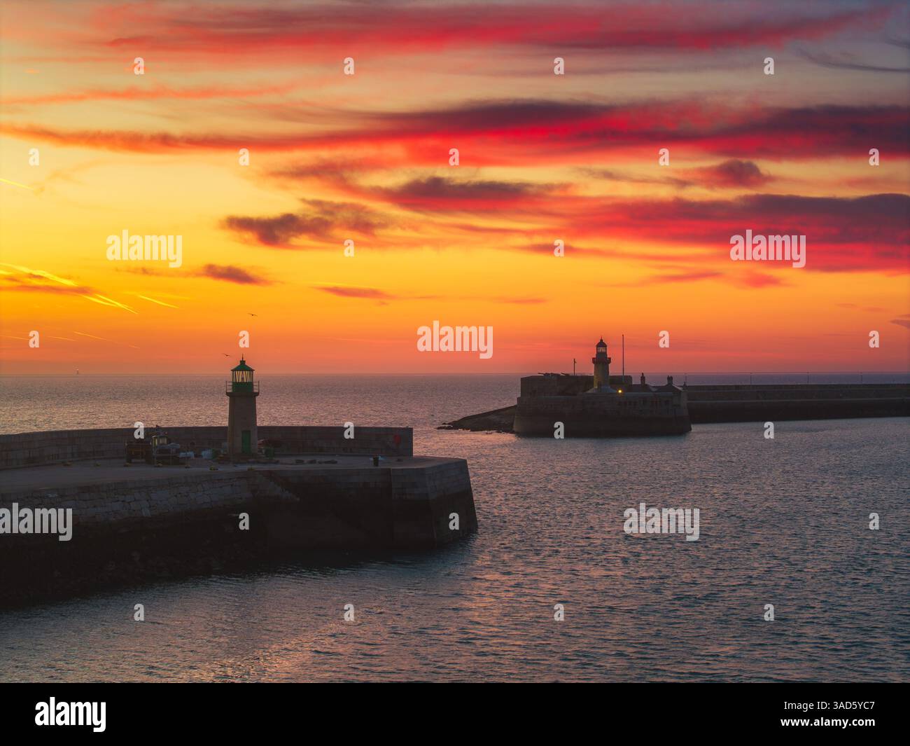 Red sky before sunrise over Dún Laoghaire lighthouses Stock Photo - Alamy