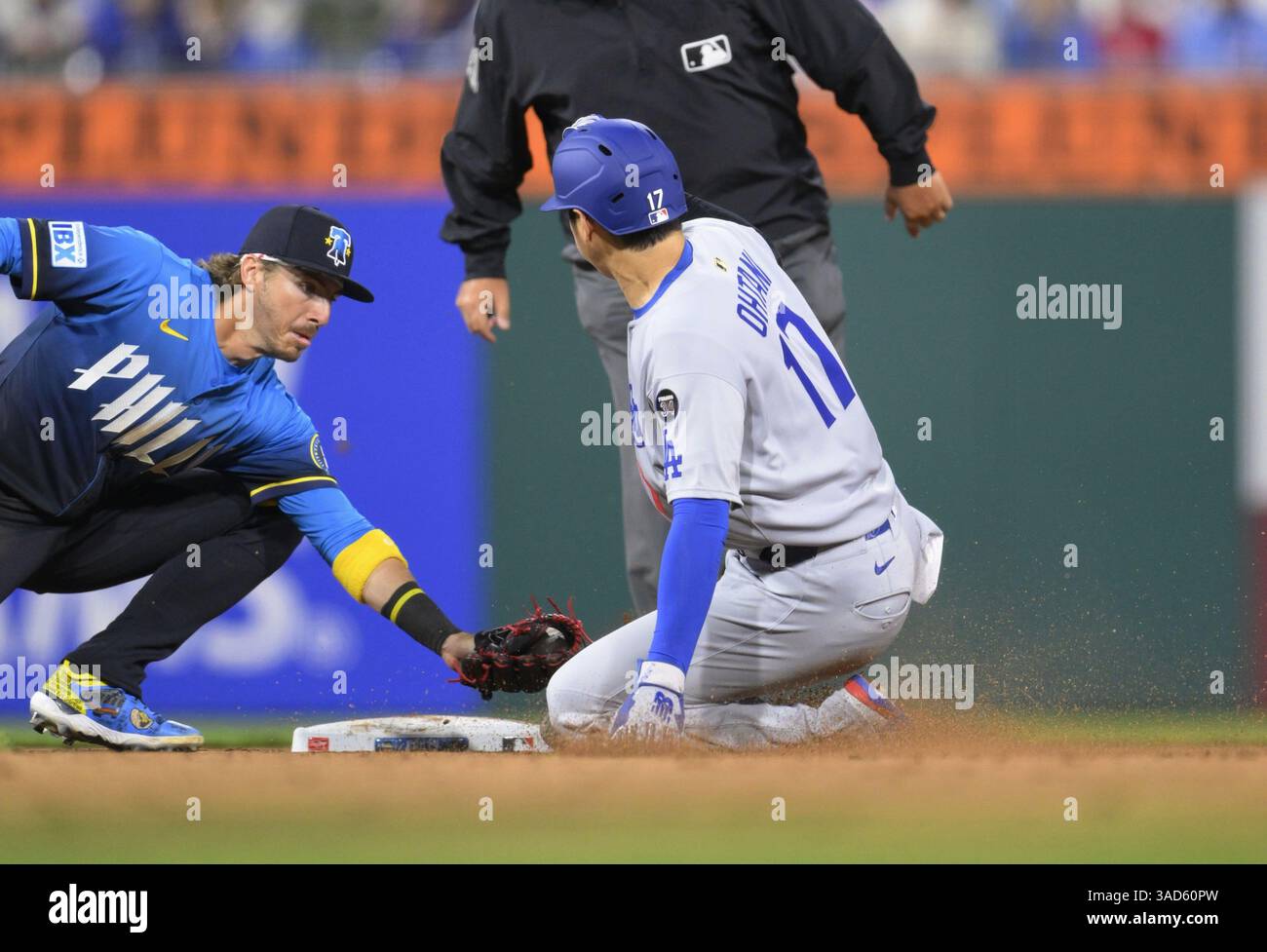 Los Angeles Dodgers designated hitter Shohei Ohtani (R) is caught stealing second base in the ...