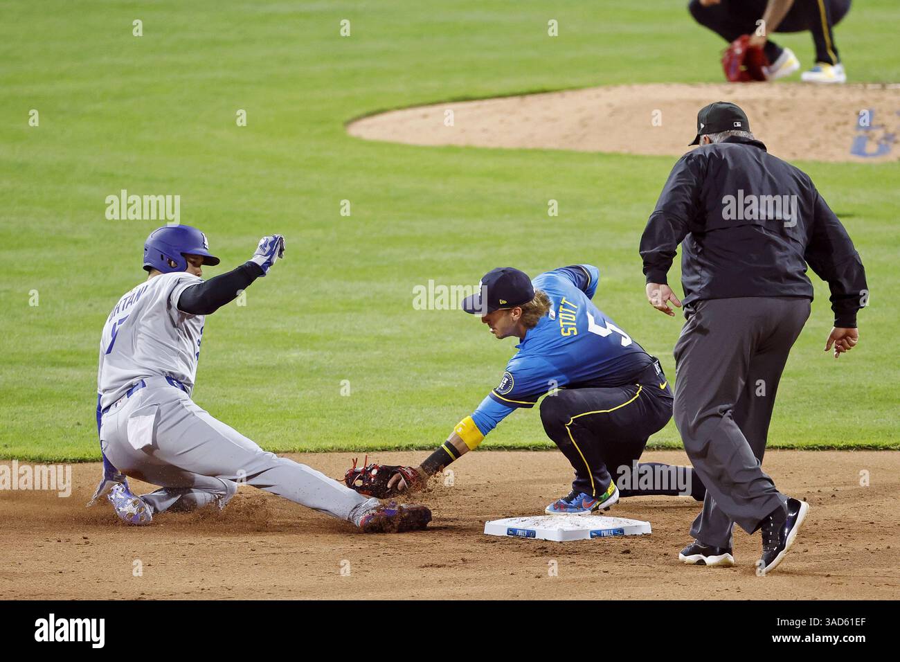 Los Angeles Dodgers designated hitter Shohei Ohtani (L) is caught ...
