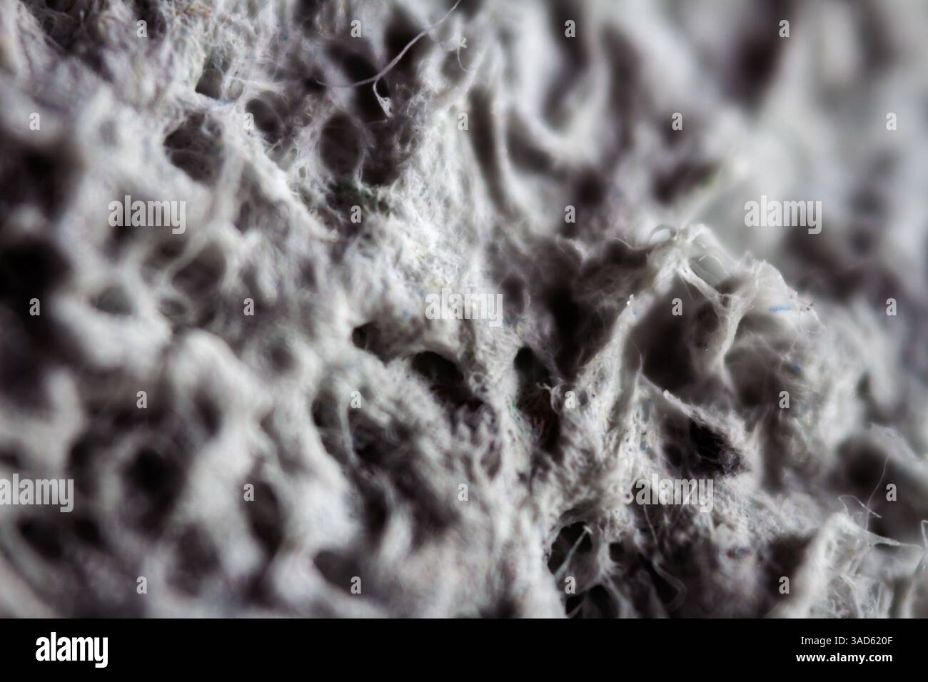 Extreme close up of old gray handmade paper clay with a structure and ...