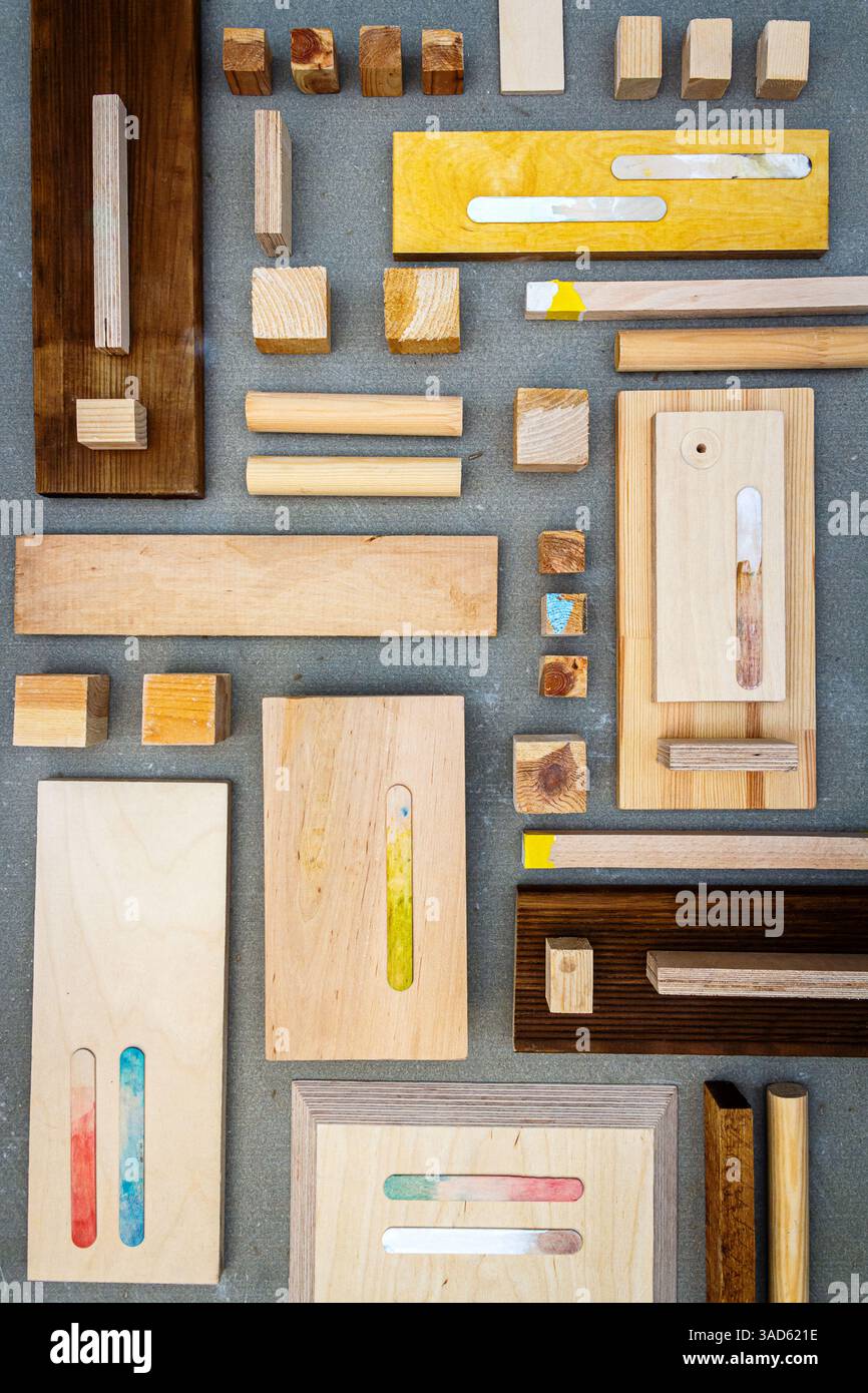 Flat lay of various wood and plywood pieces on concrete texture ...