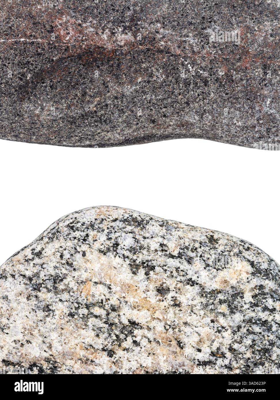 Edges of two pebbles isolated on white background with a space for text ...