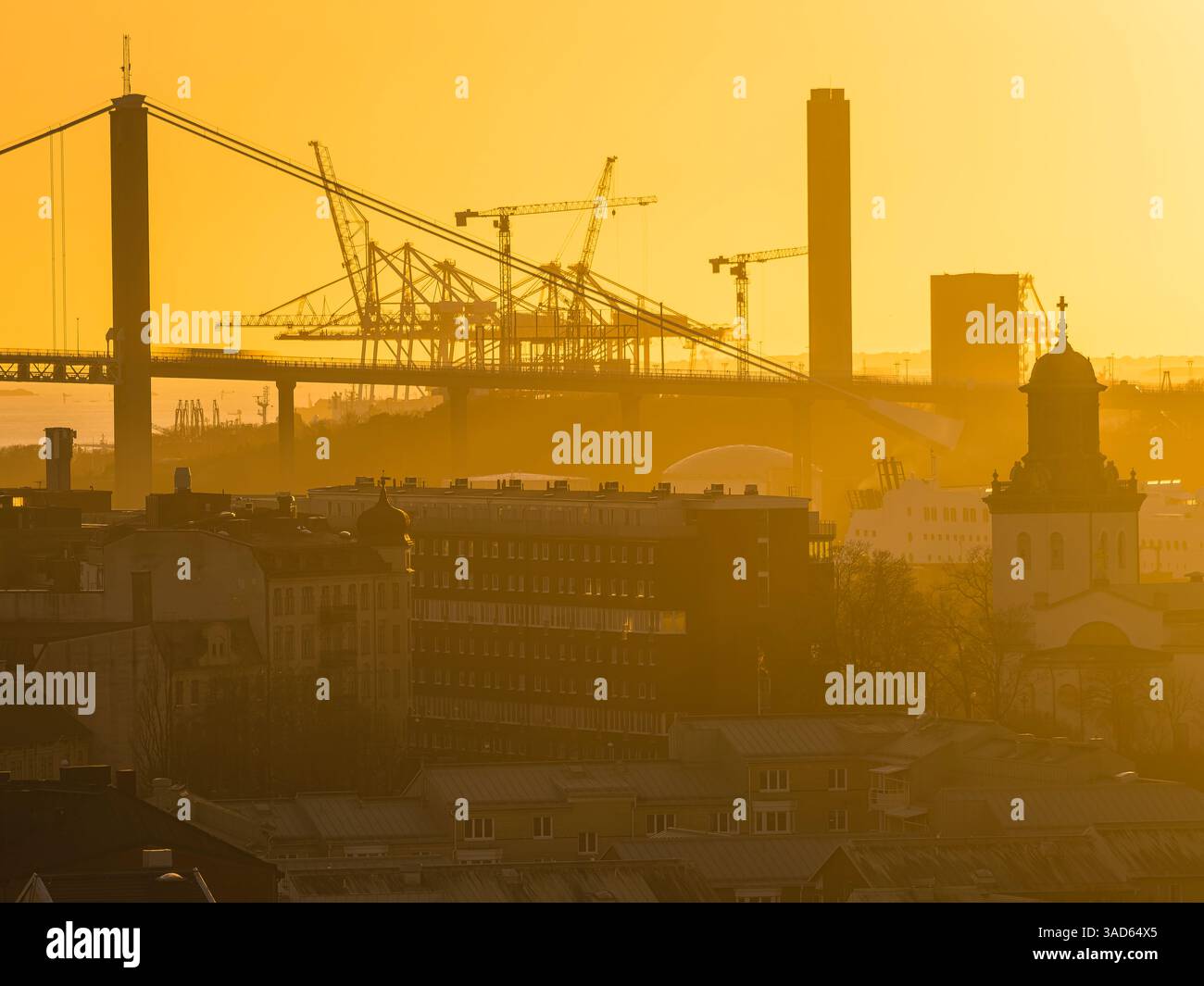 Gothenburg's skyline is illuminated by a captivating sunset, casting ...