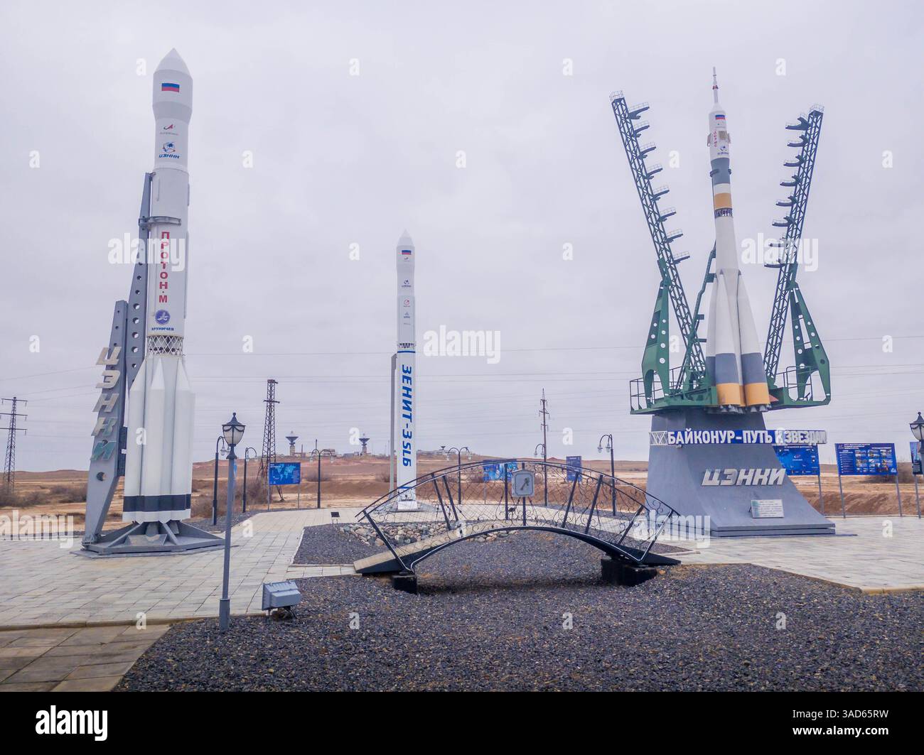 Proton, Zenit, and Soyuz rocket replicas on display at Baikonur cosmodrome, a Russian city ...