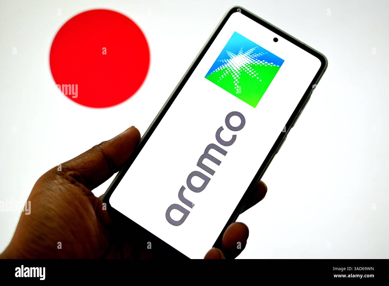 In this photo illustration, an Aramco logo is seen displayed on a ...