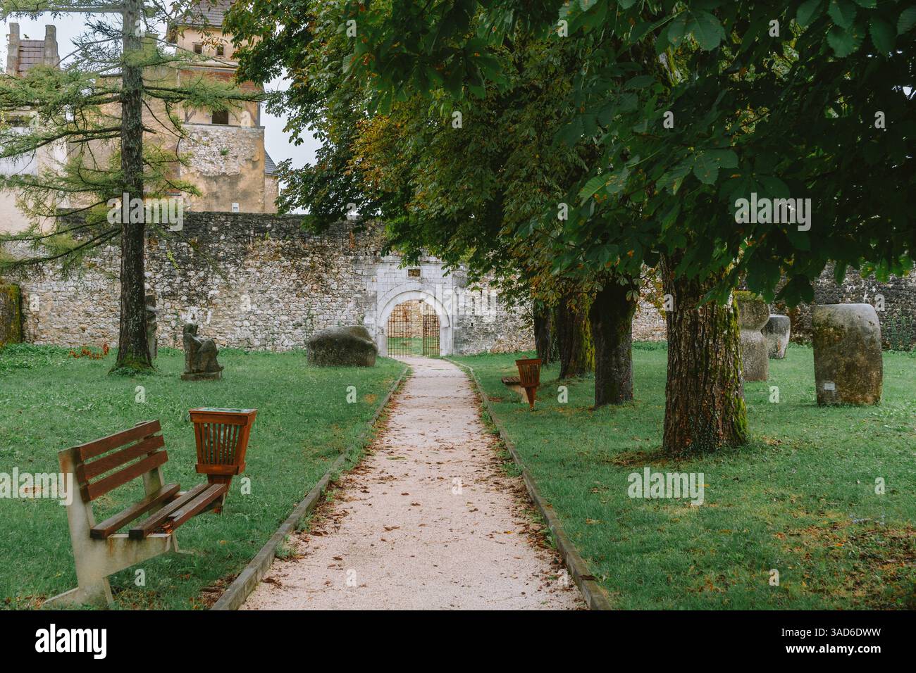A peaceful trail leads to the arched gate of Ostrožac Castle ...