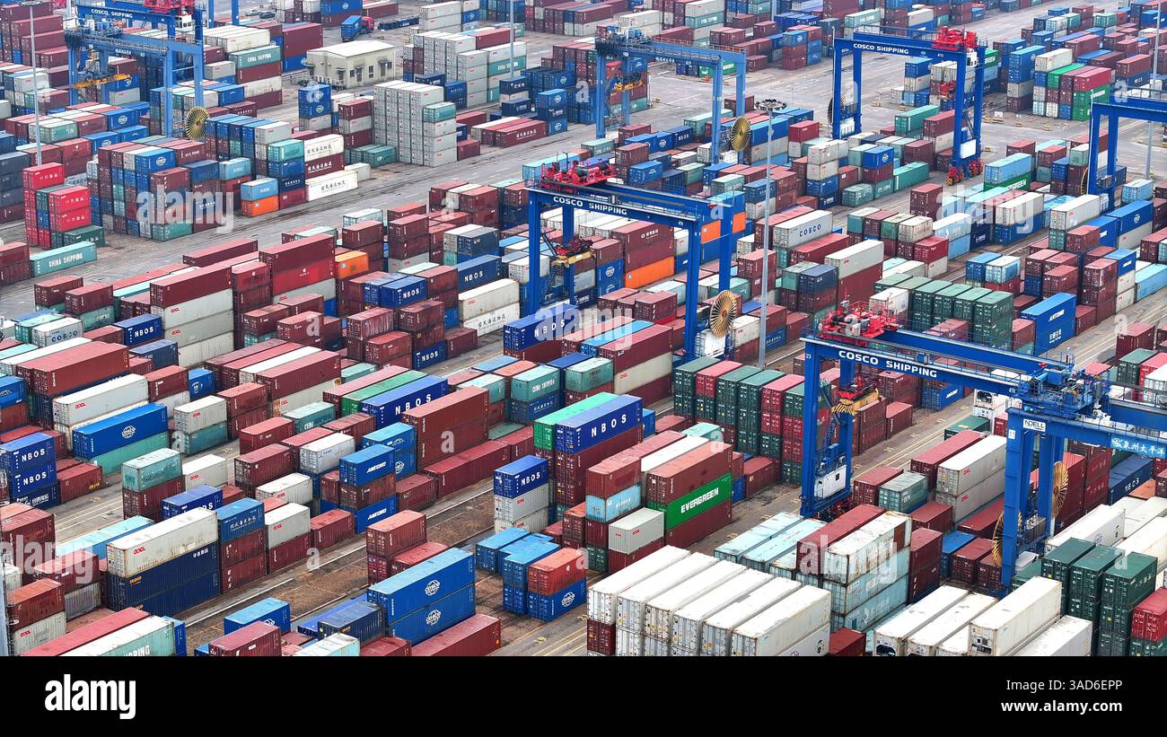 SHISHI, CHINA - APRIL 5, 2025 - Cargo ships load and unload containers ...