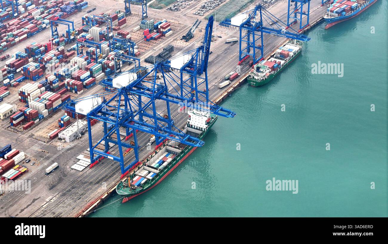 SHISHI, CHINA - APRIL 5, 2025 - Cargo ships load and unload containers ...