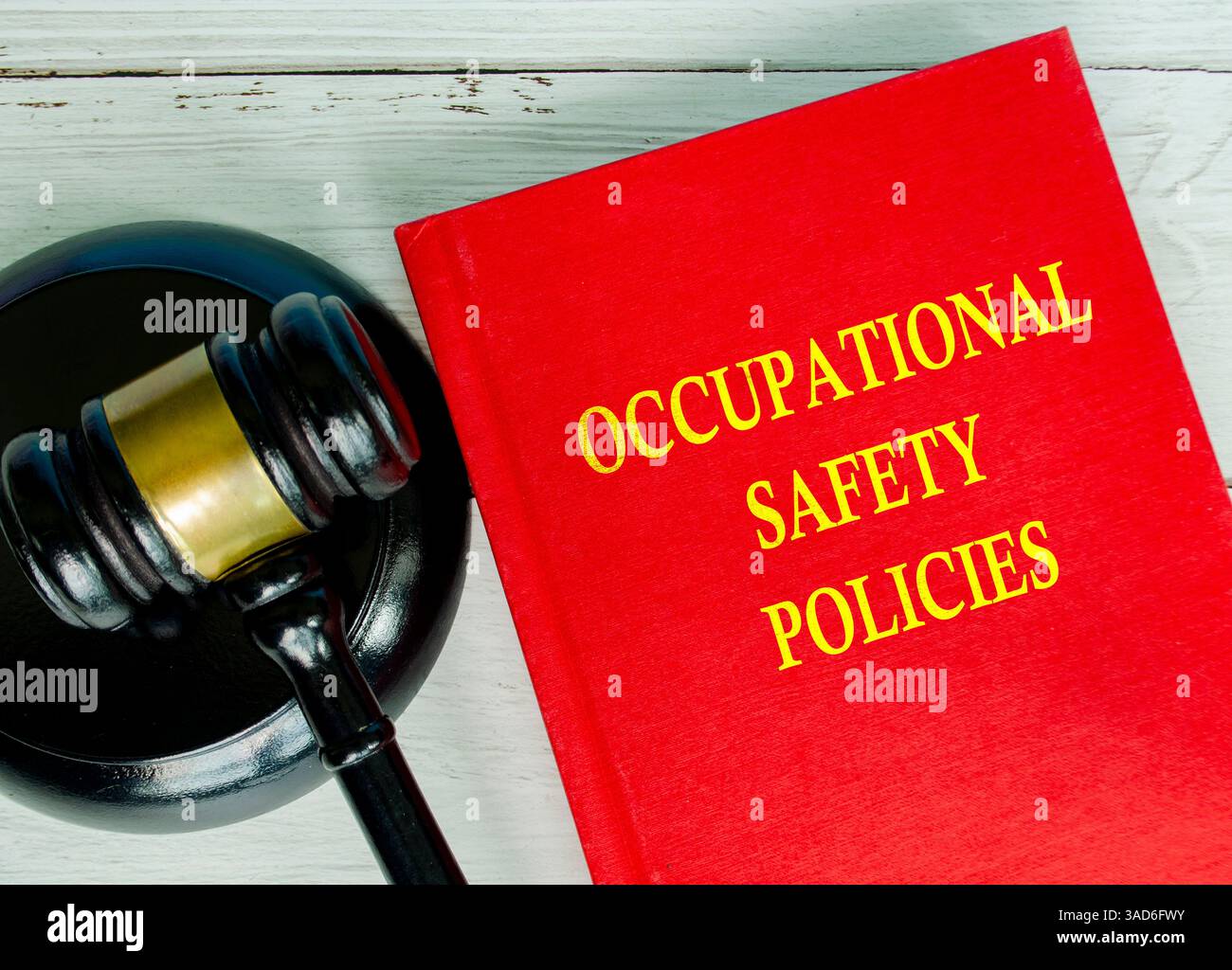 Top view of Occupational Safety policies text on red cover book with ...