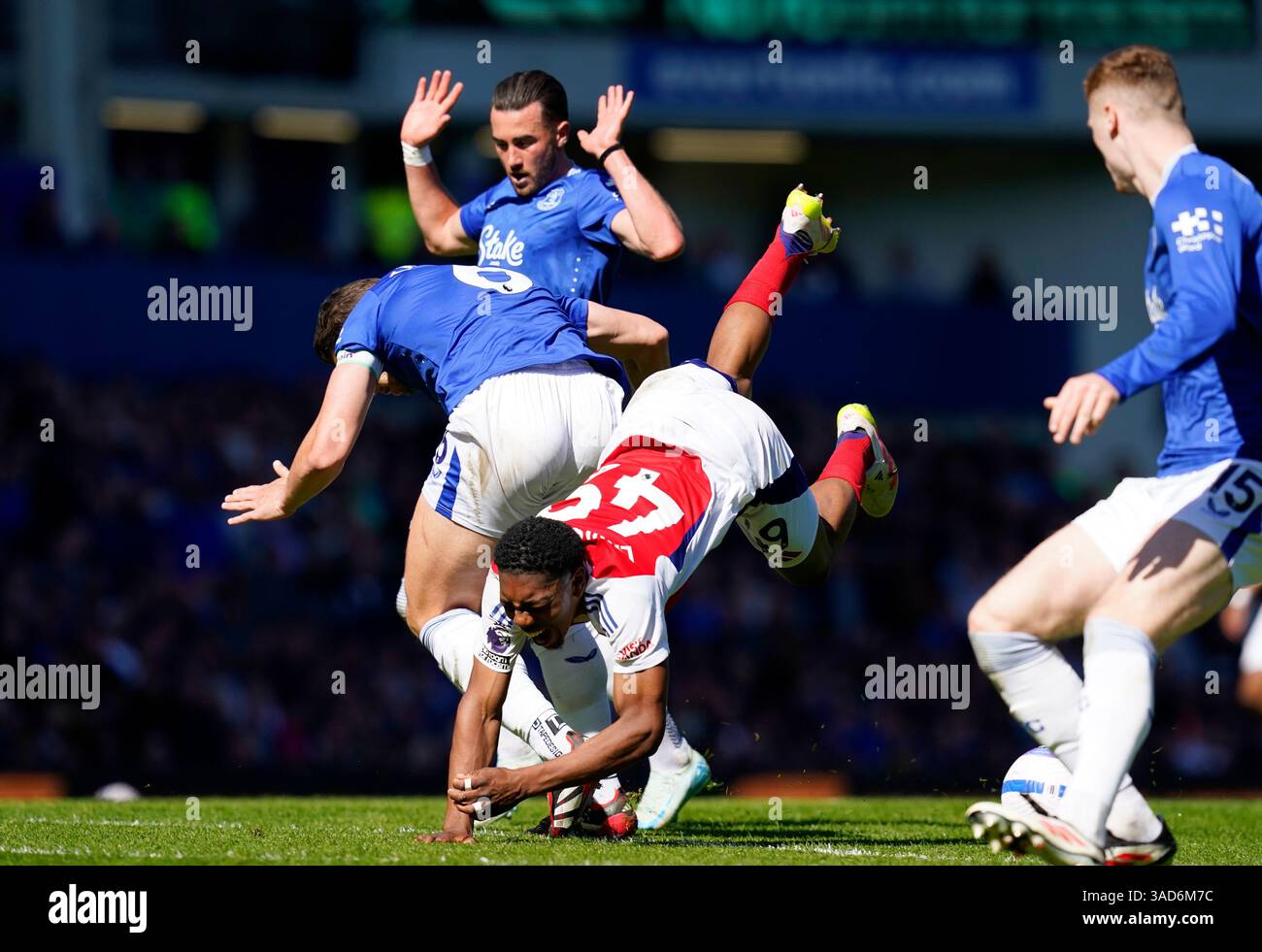 Liverpool, UK. 5th Apr, 2025. Myles Lewis-Skelly of Arsenal tackled by ...