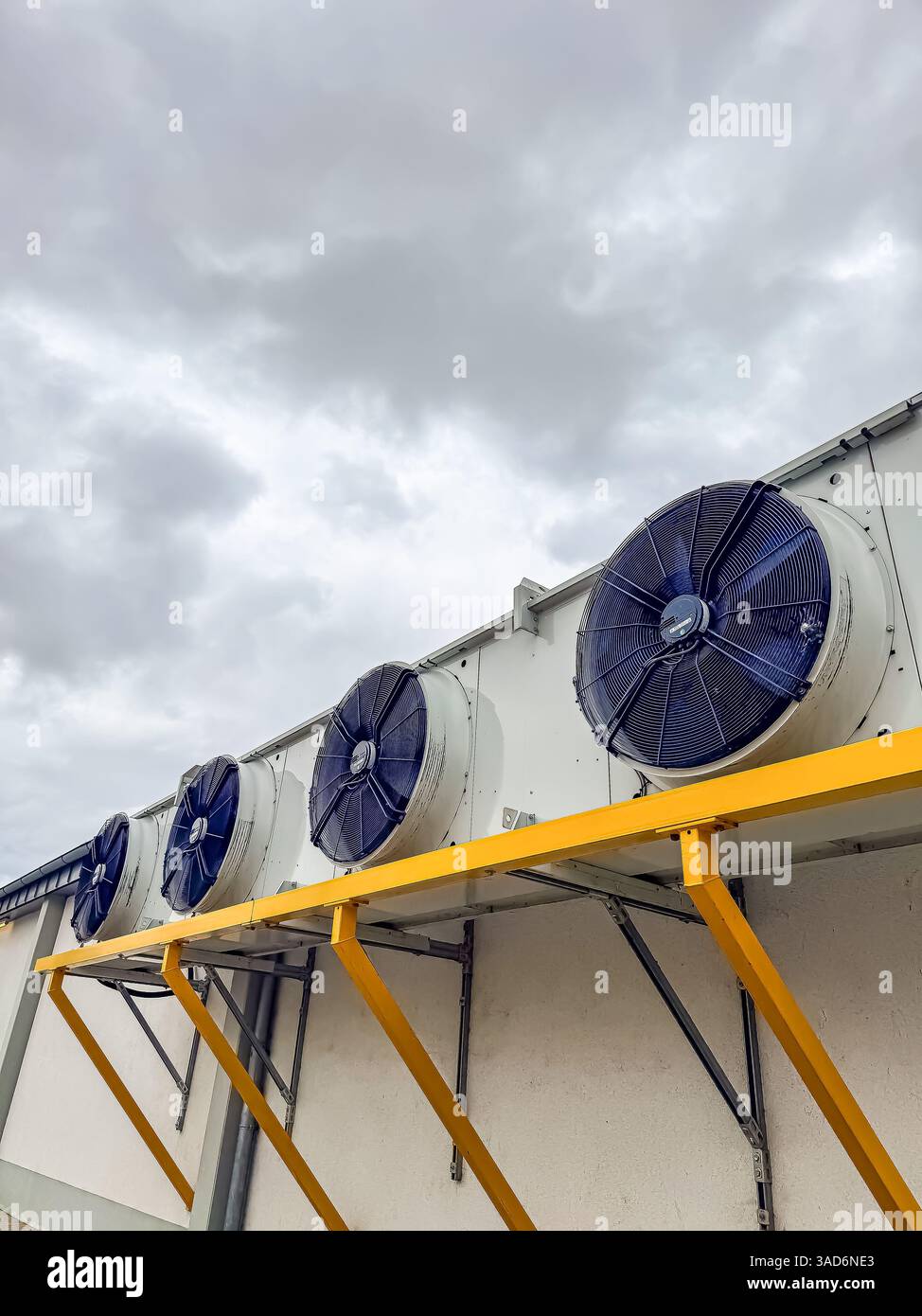 Industrial Ventilation Fans on Building Wall Against Cloudy Sky ...