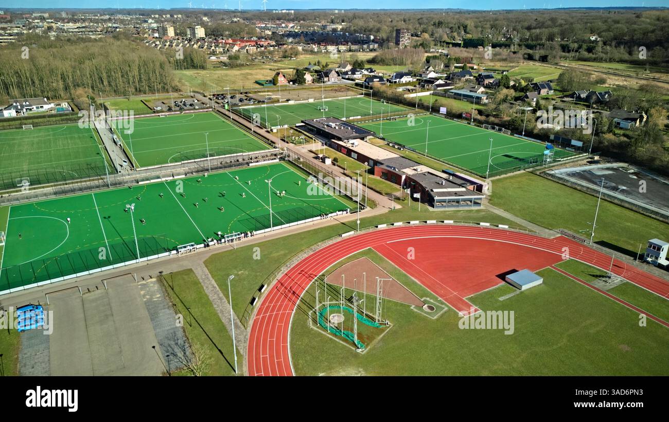 Sportpark with soccer fields and running track aerial drone view from ...