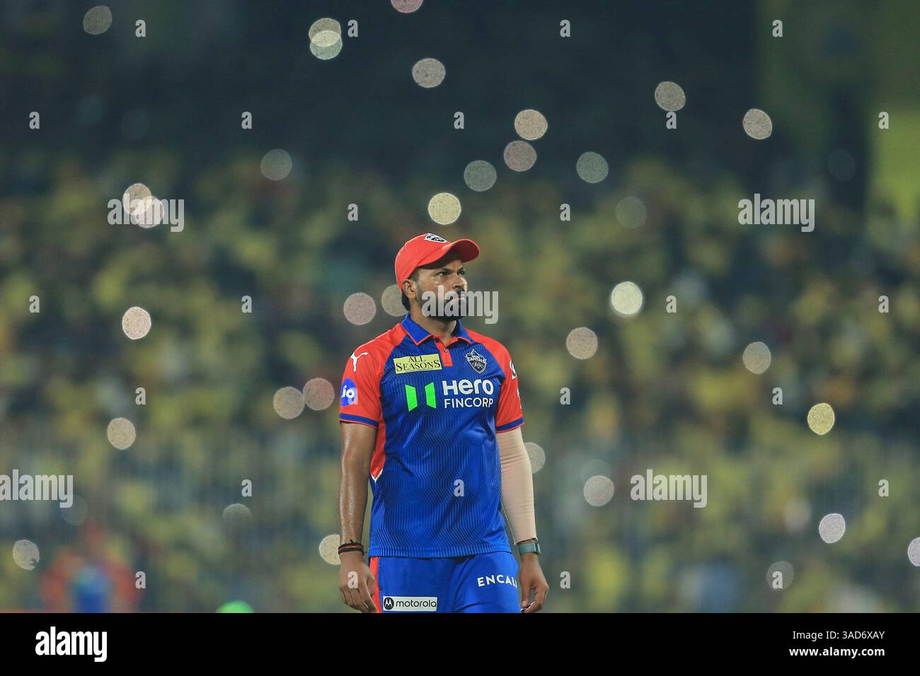 Delhi Capitals' Mukesh Kumar walks back to his fielding position during ...