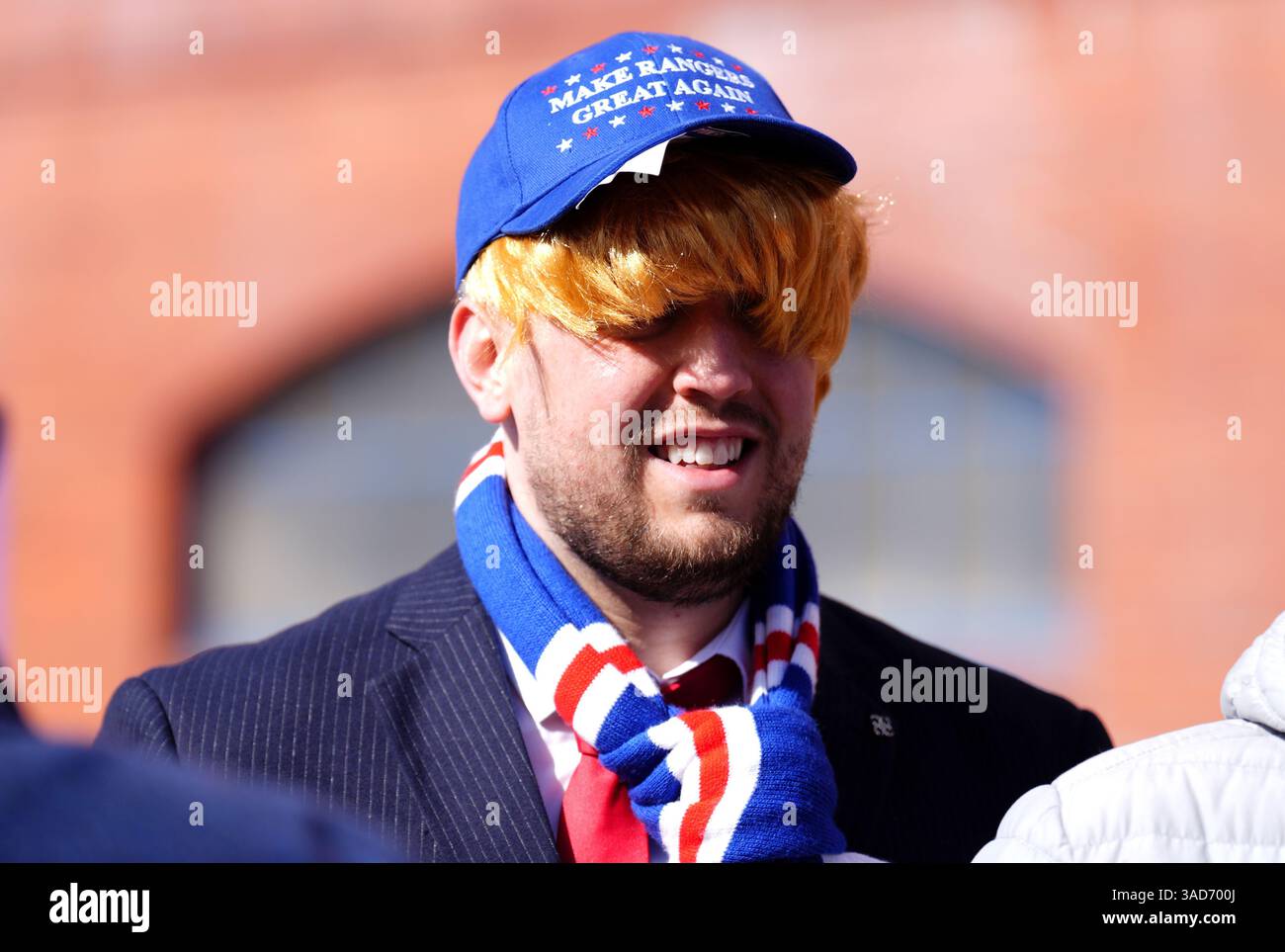 A fan sports a Make Rangers Great Again cap ahead of the William Hill ...