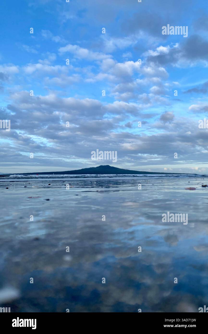 Clear weather over Rangitoto Island, Auckland. Low tide reveals ...