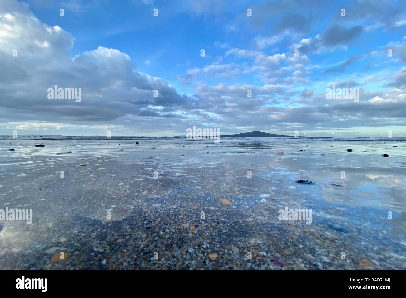 Clear weather over Rangitoto Island, Auckland. Low tide reveals ...