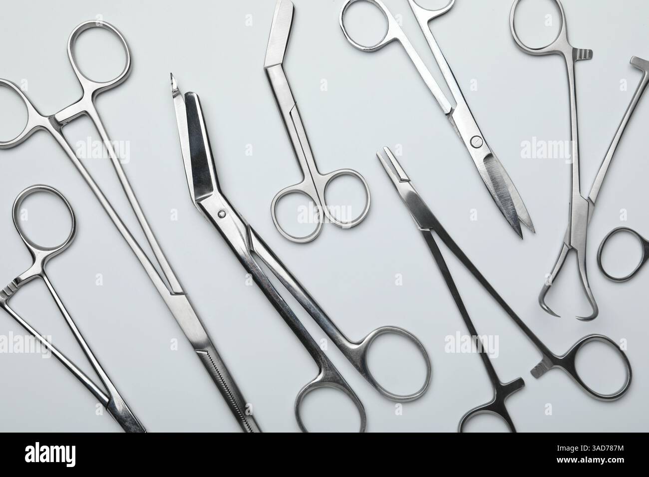 Different surgical tools on light gray background, flat lay Stock Photo ...