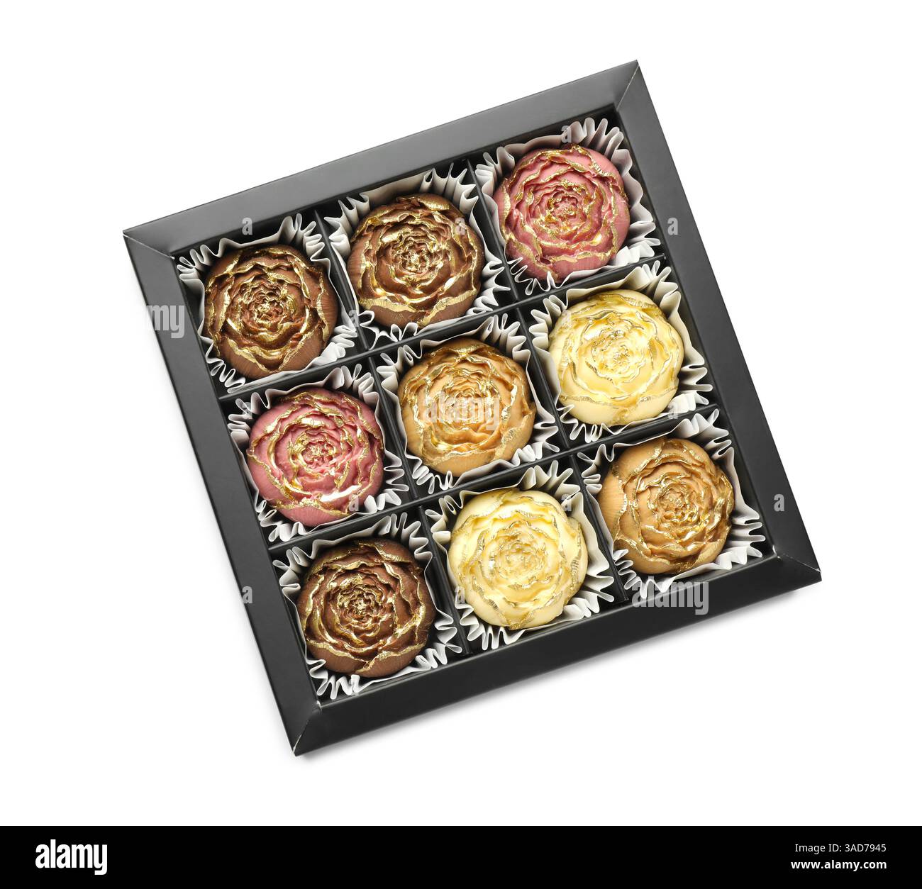 Flower shaped chocolate bonbons in box isolated on white, top view ...
