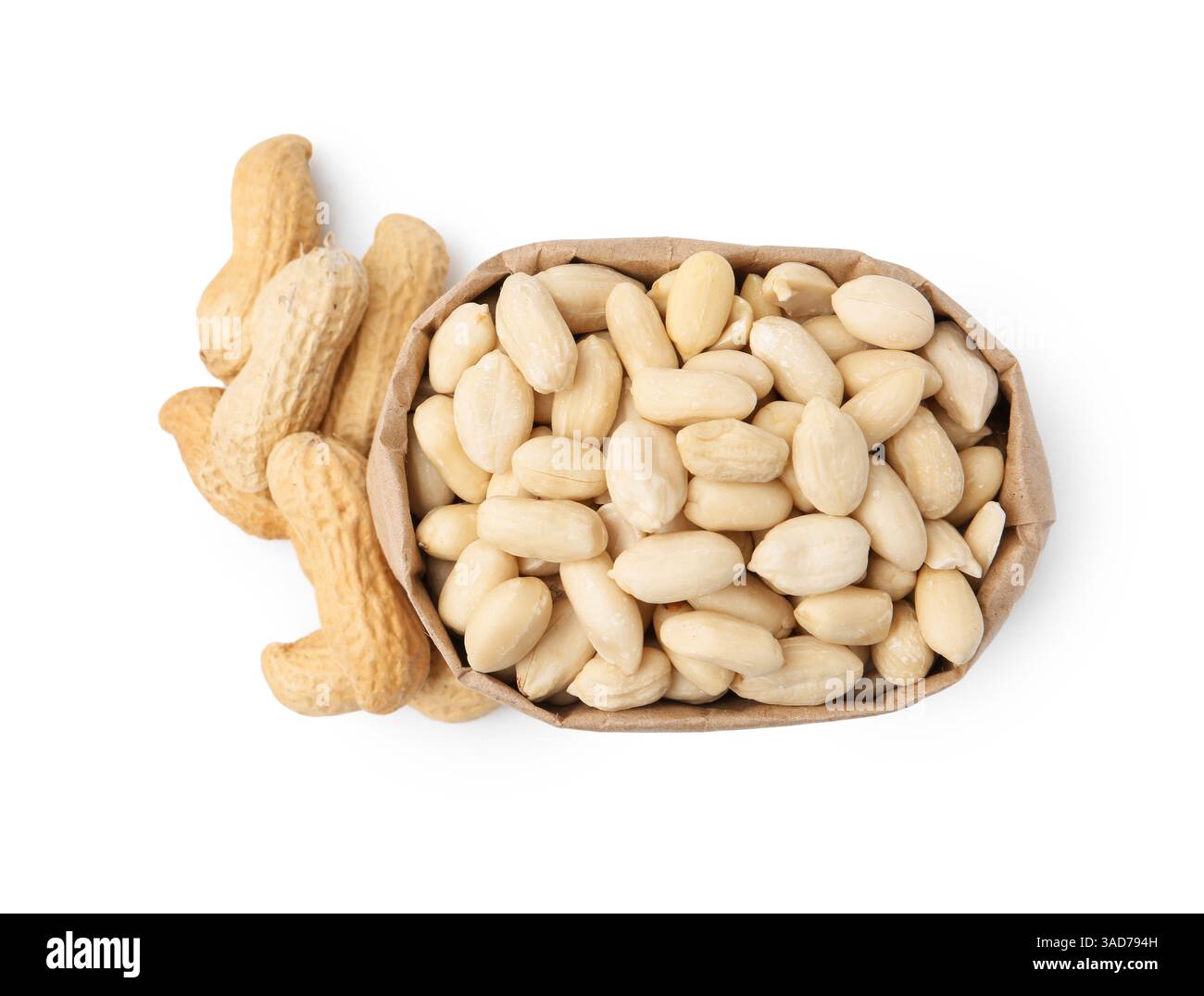 Peeled peanuts in paper bag and unpeeled ones isolated on white, top ...
