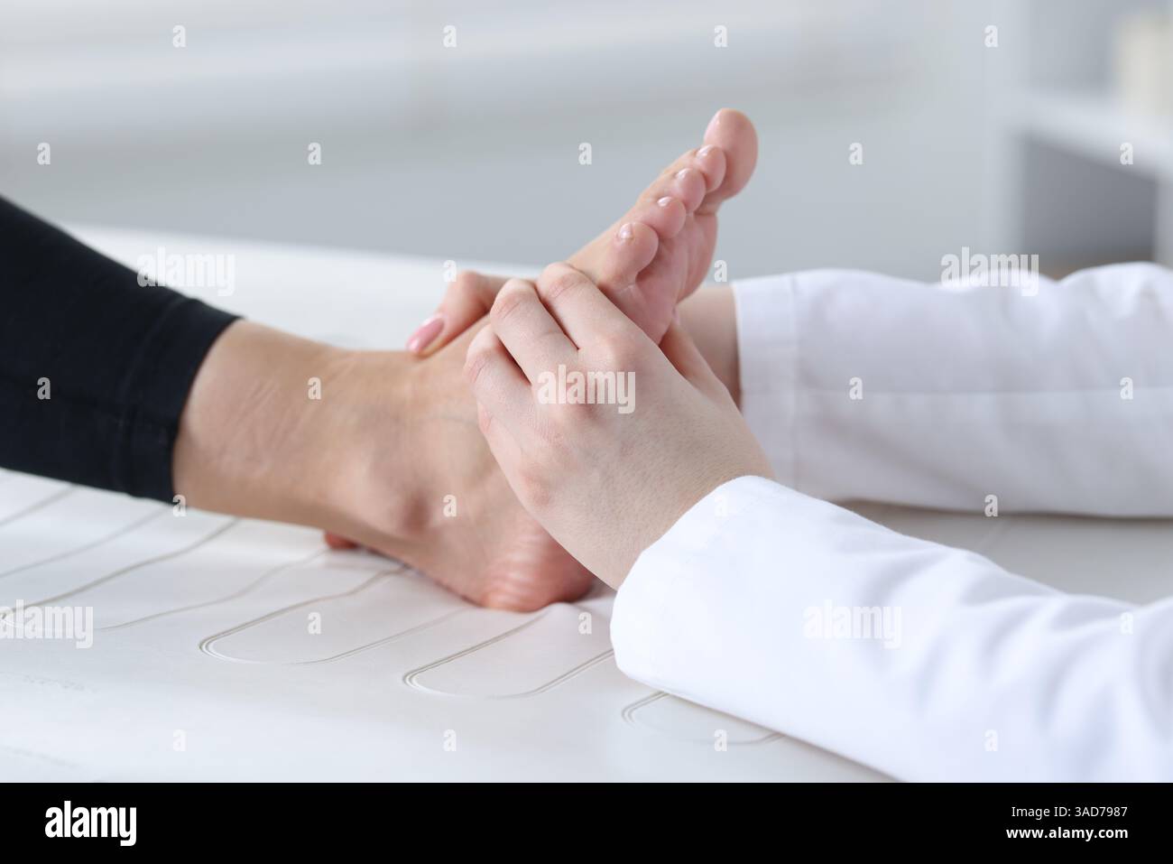 Doctor examining patient's foot in hospital, closeup Stock Photo - Alamy
