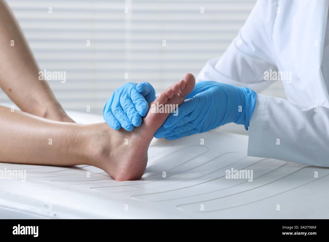 Doctor examining patient's foot in hospital, closeup Stock Photo - Alamy