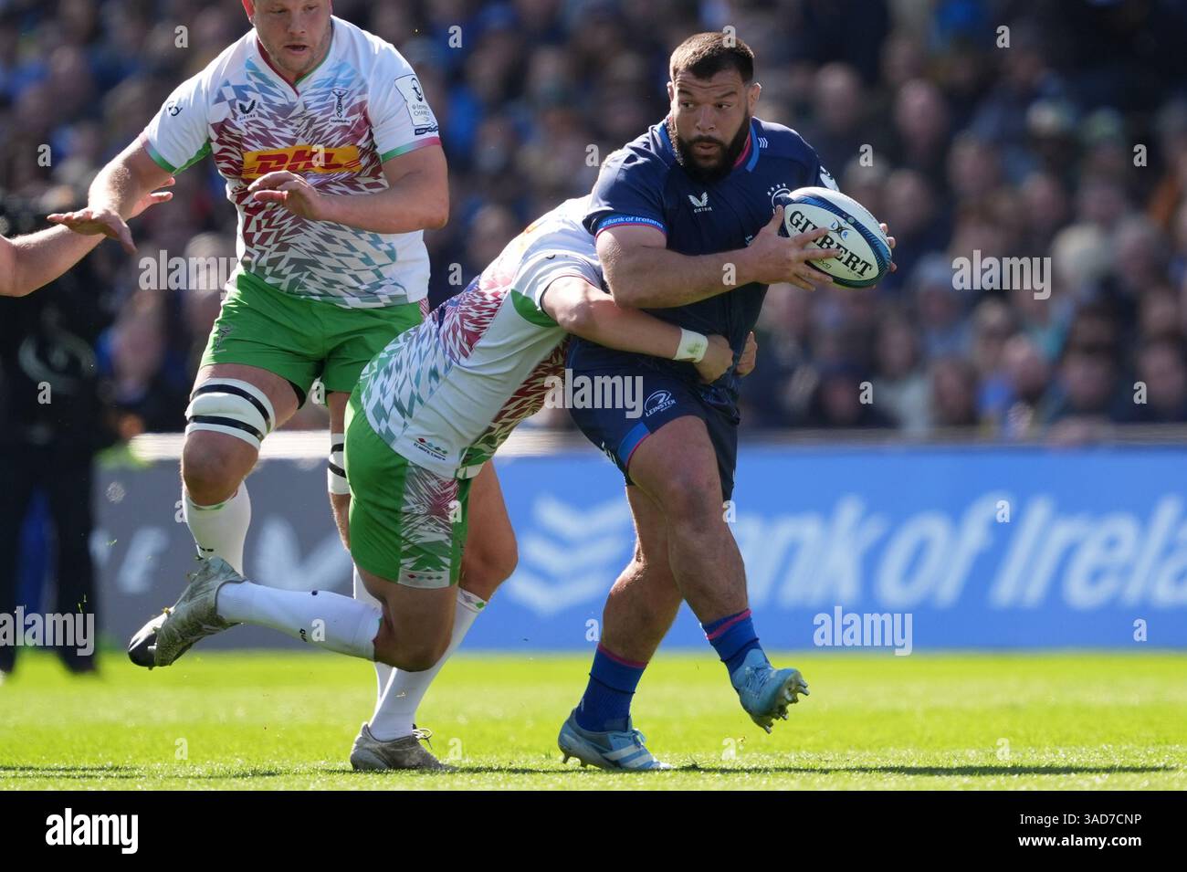 Leinster's Rabah Slimani (right) is tackled by Harlequins' Jack Walker ...