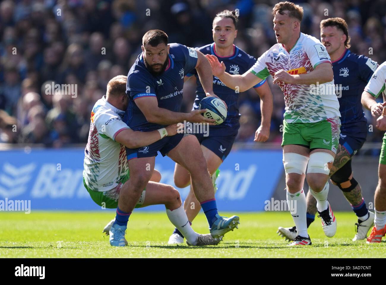 Leinster's Rabah Slimani (second left) is tackled by Harlequins' Jack ...