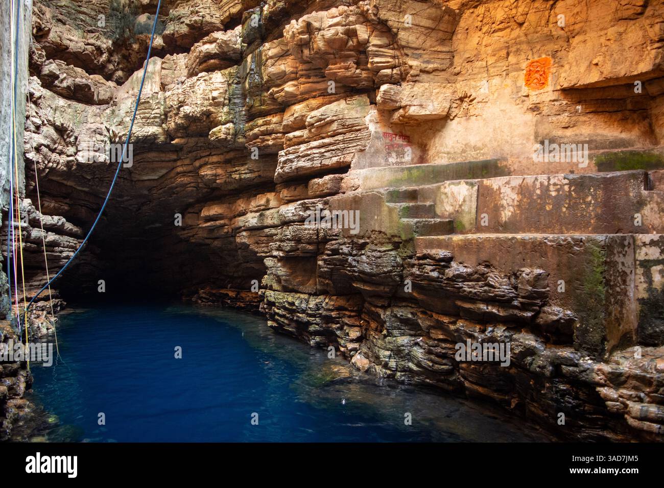 This is naturally occuring blue water in a cave at a location called ...