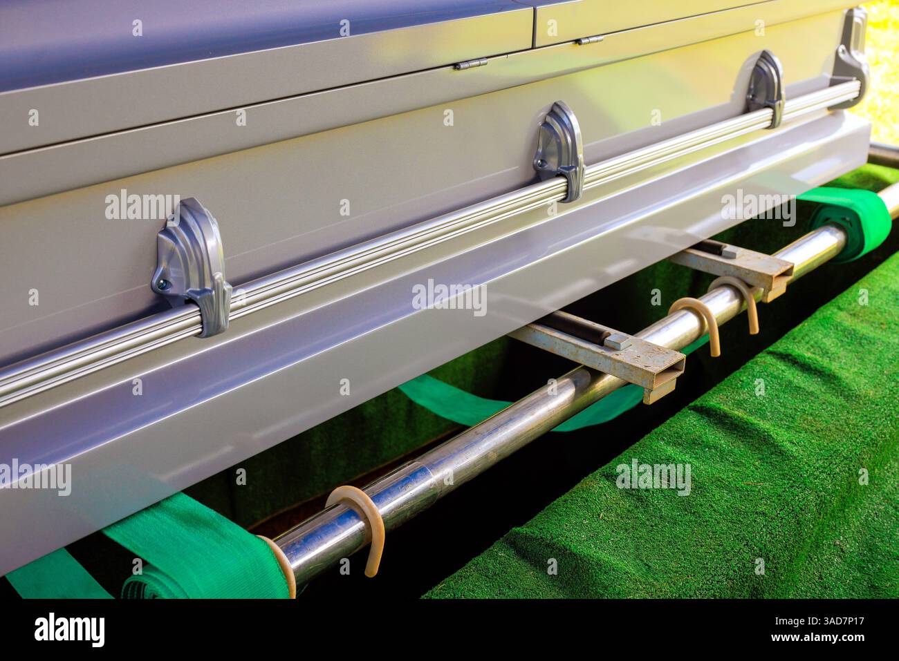 Funeral casket is prominently placed on green velvet surface, ready for ...