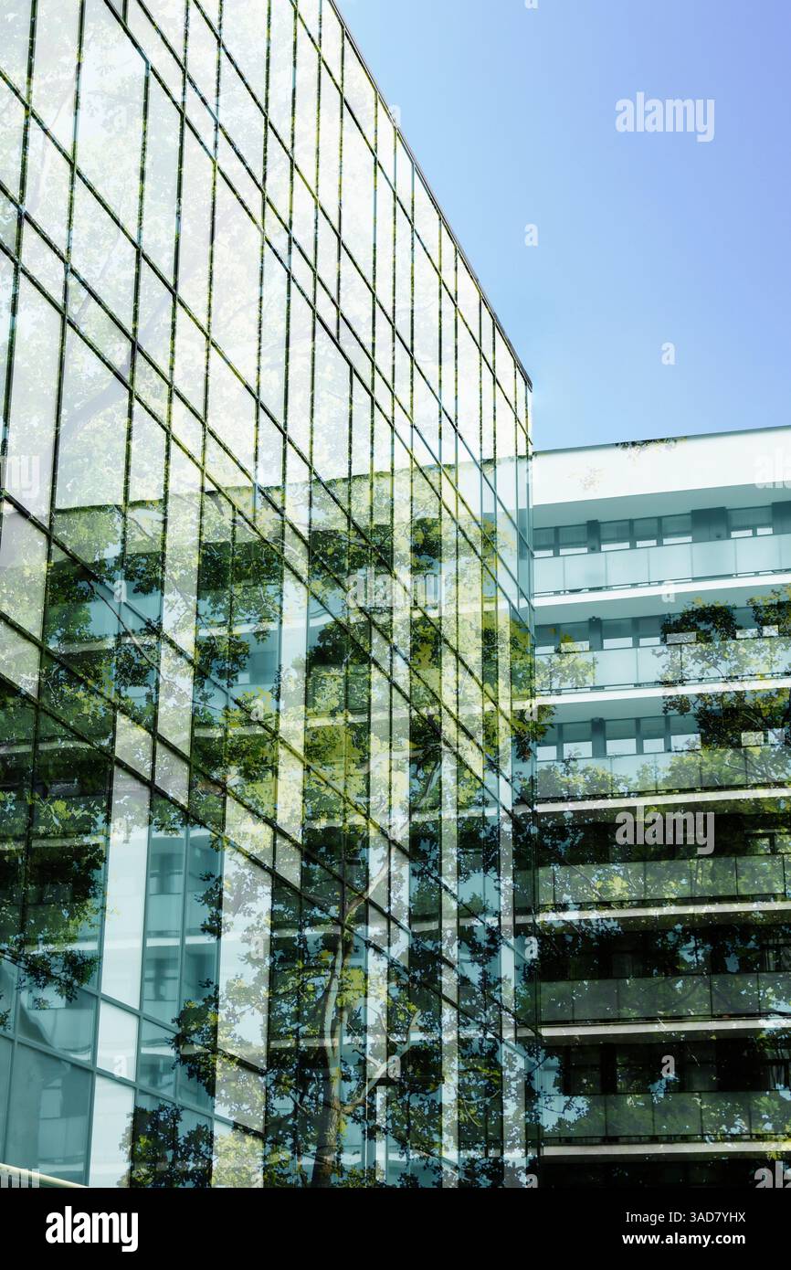 Modern buildings and lush tree against blue sky, double exposure Stock ...