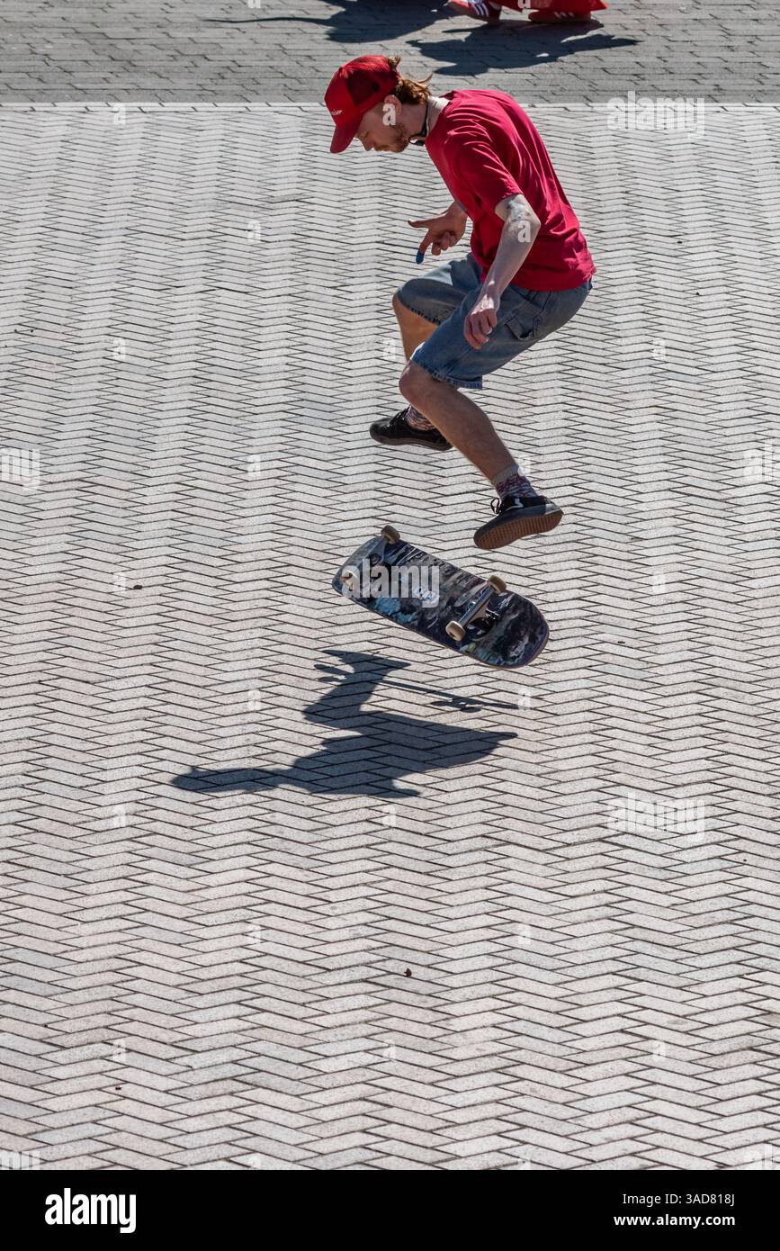 Brighton, April 5th 2025: A skateboarder enjoying the spring sunshine ...