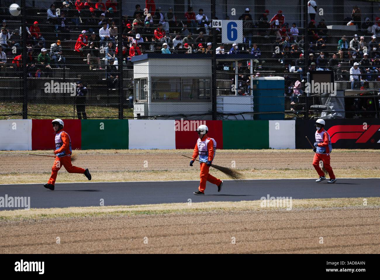 5th March 2025: Suzuka, Japan : Fire fighters rush to put out grass ...