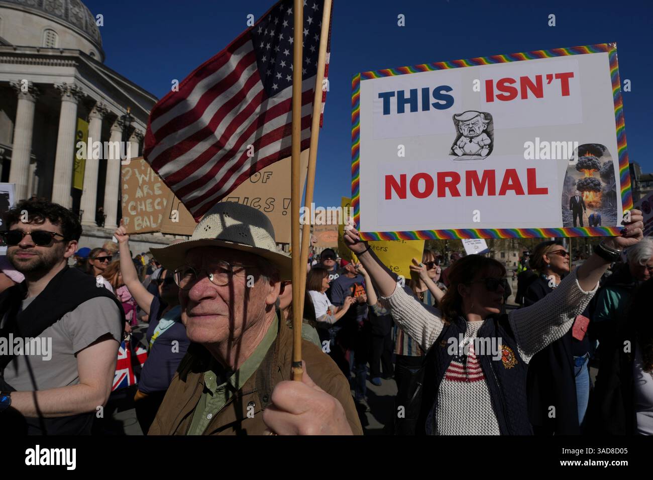 Protesters hold signs as they join a "Hands Off!" demonstration against ...