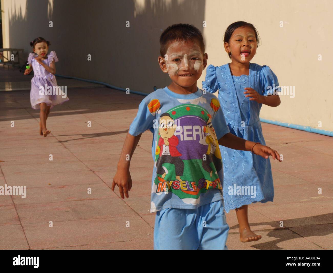 Yangon, Myanmar, Februry 18, 2015: Happy children with typical Burmese ...