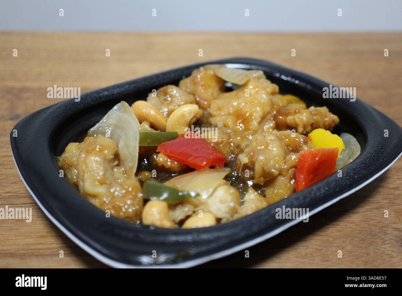 Stir-fried chicken and cashew nuts (Chinese food) purchased at a ...